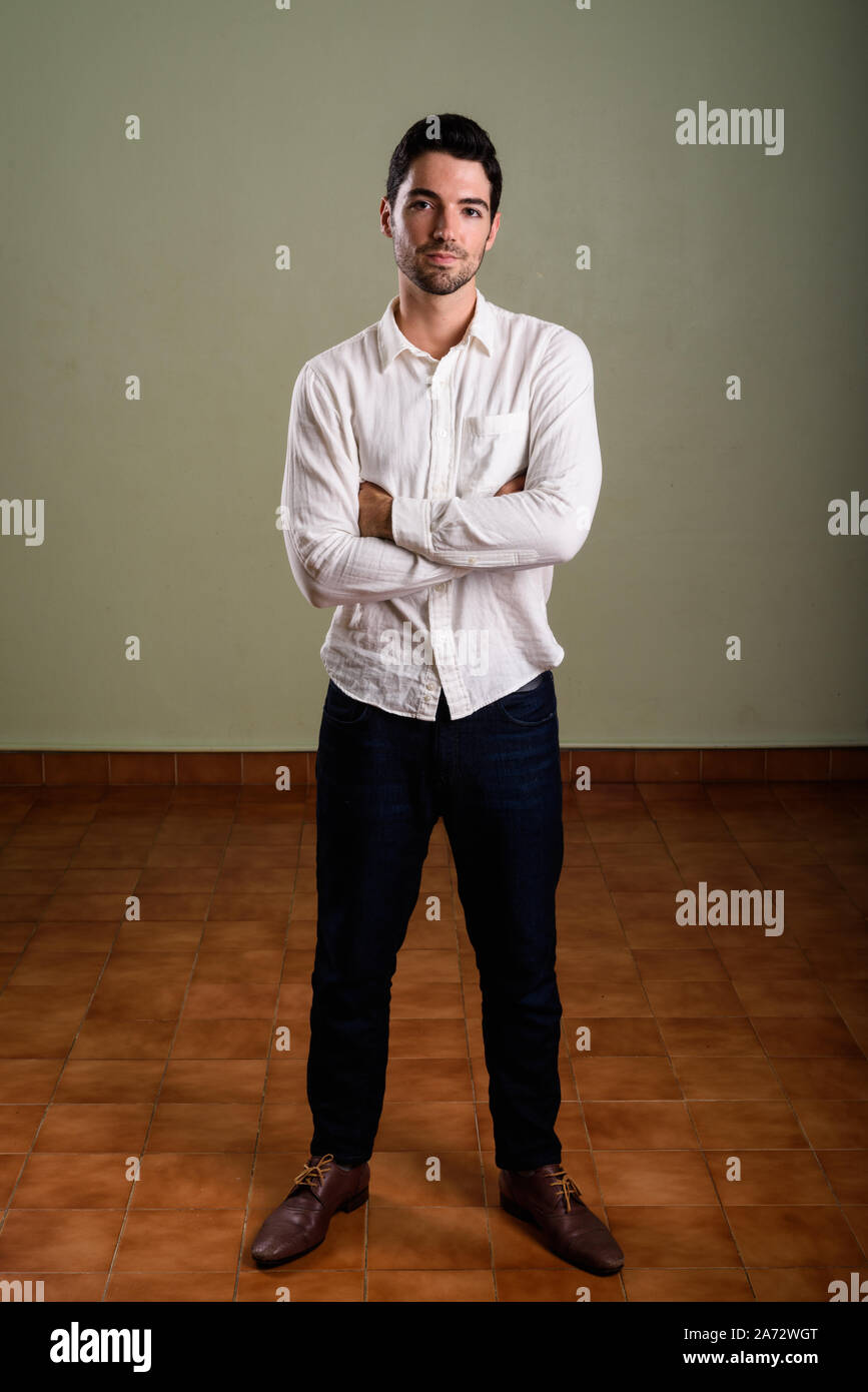 Full body shot of young handsome businessman with stubble beard Stock ...