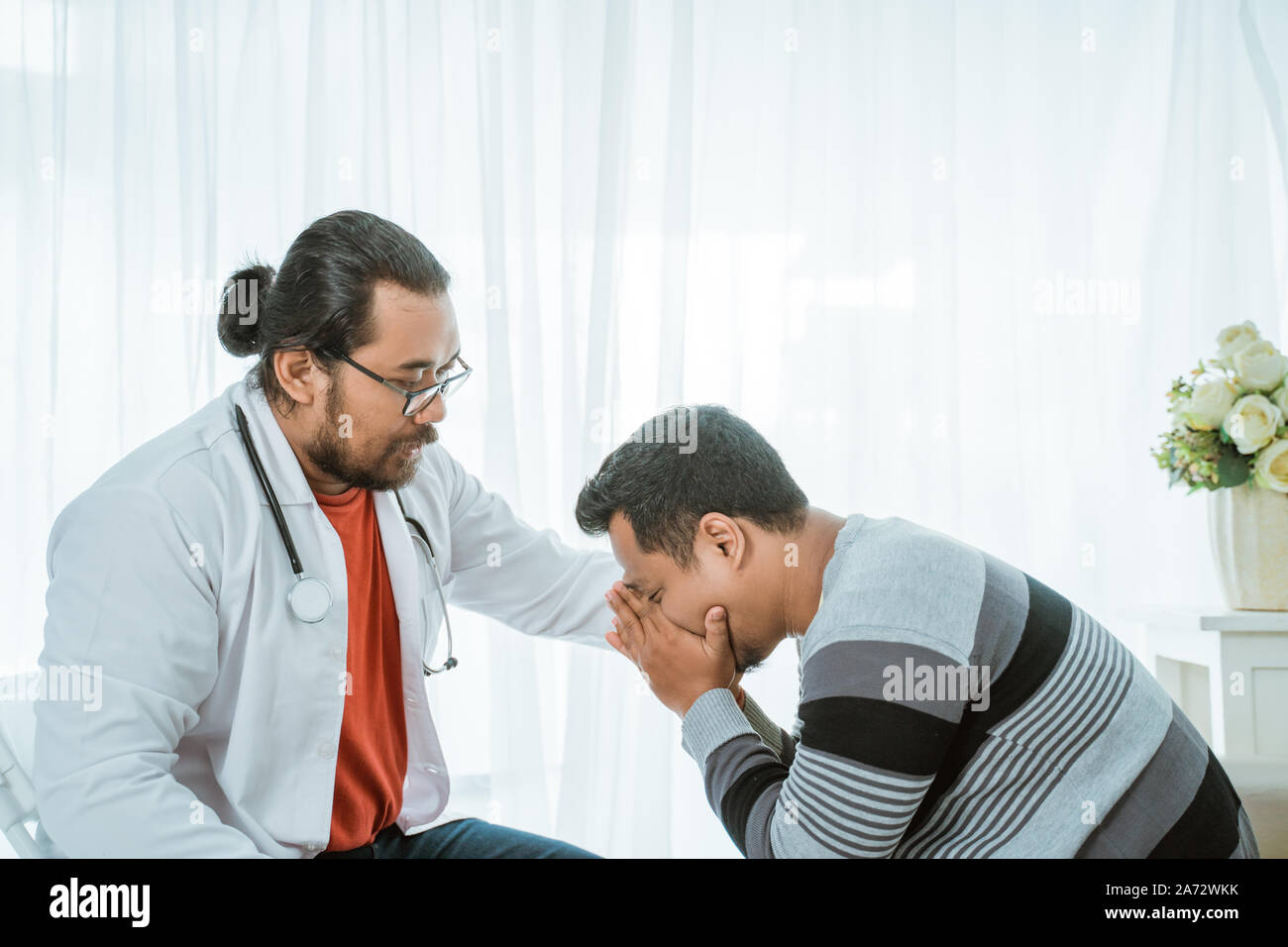 sad patient consultation with doctor try to comfort him Stock Photo - Alamy