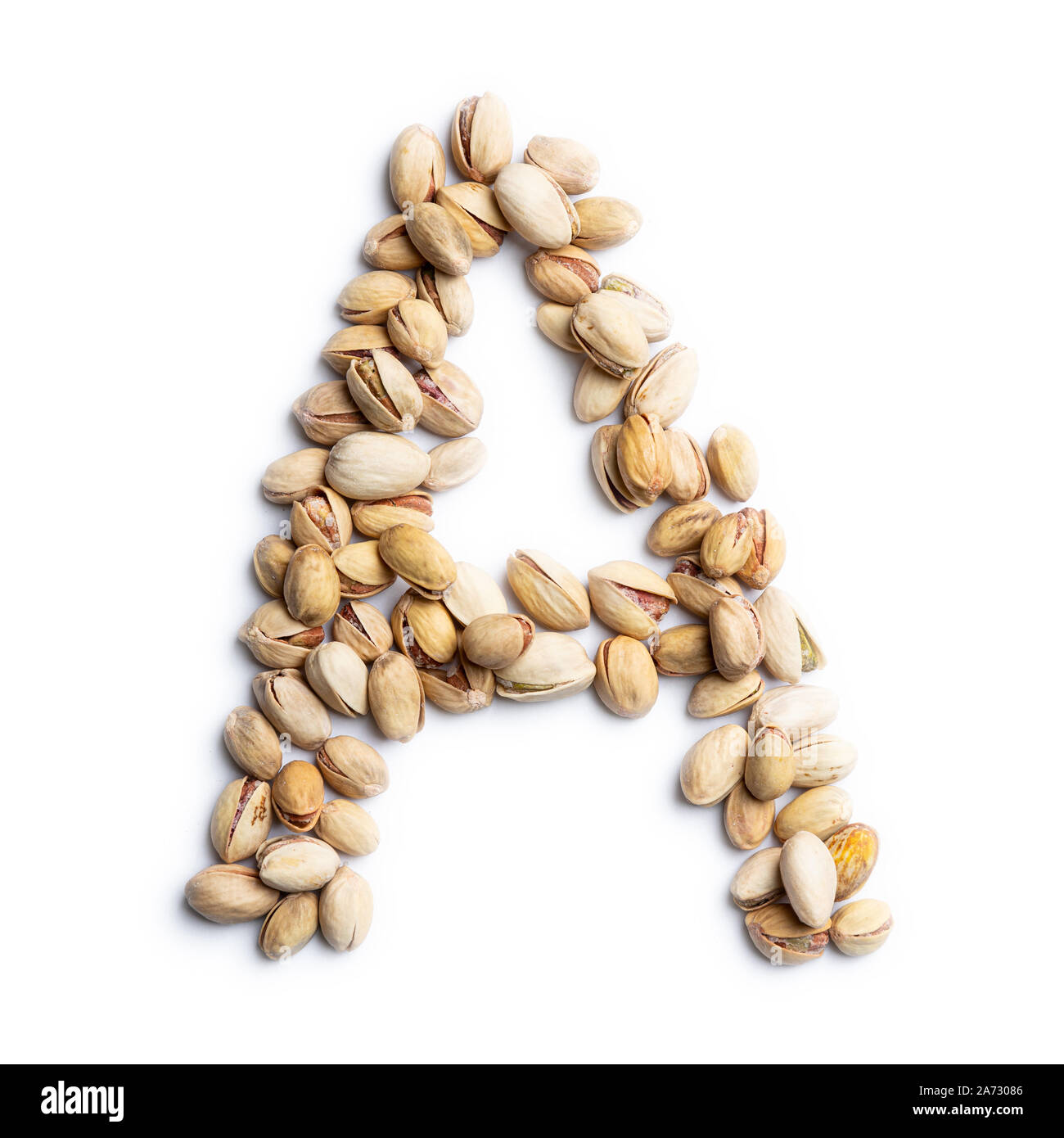 The letter "A" of the English alphabet from a unpeeled pistachios on a ...