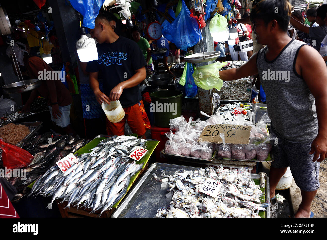 ANTIPOLO CITY, PHILIPPINES – OCTOBER 21, 2019: Customers at a public ...