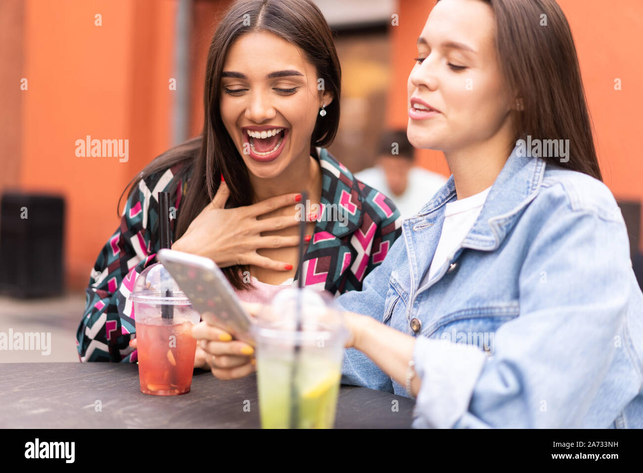 Two girls watching something in hi-res stock photography and images - Alamy