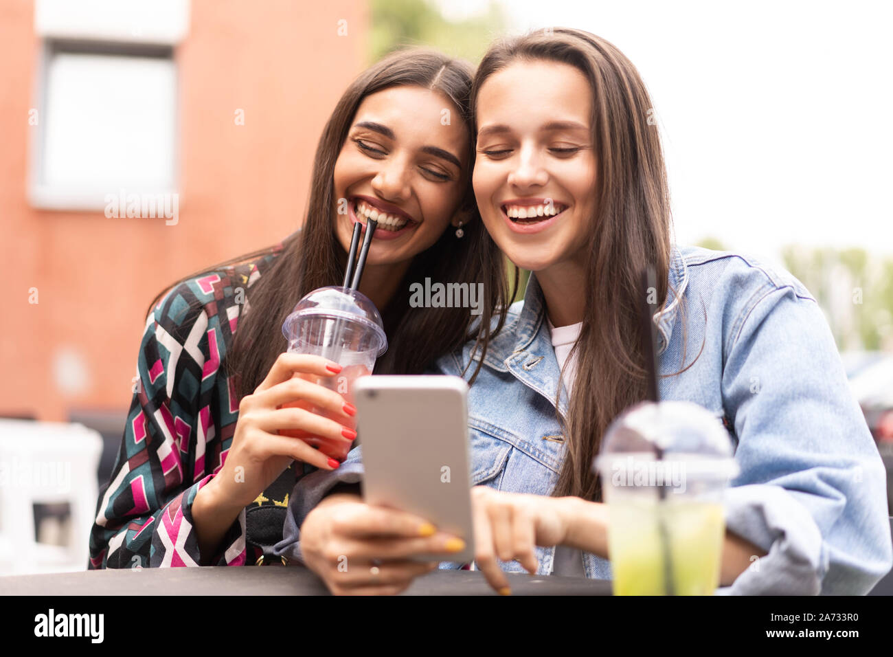 Two girls watching something in hi-res stock photography and images - Alamy