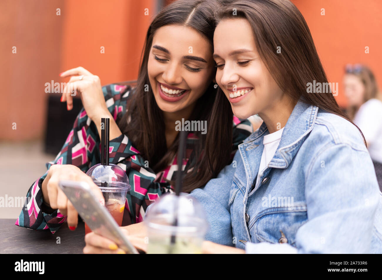 Two girls watching something in hi-res stock photography and images - Alamy