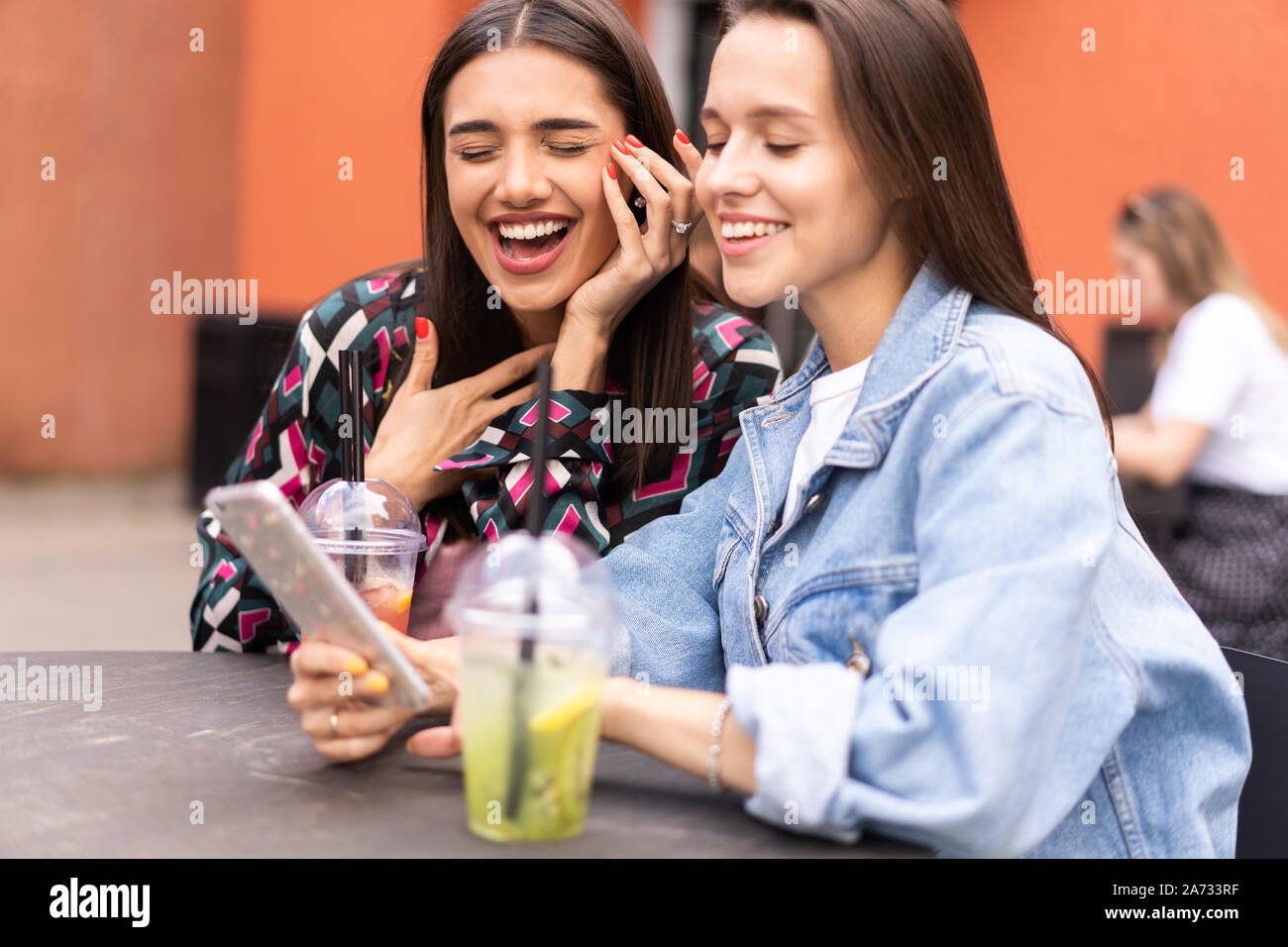 Two girls watching something in hi-res stock photography and images - Alamy