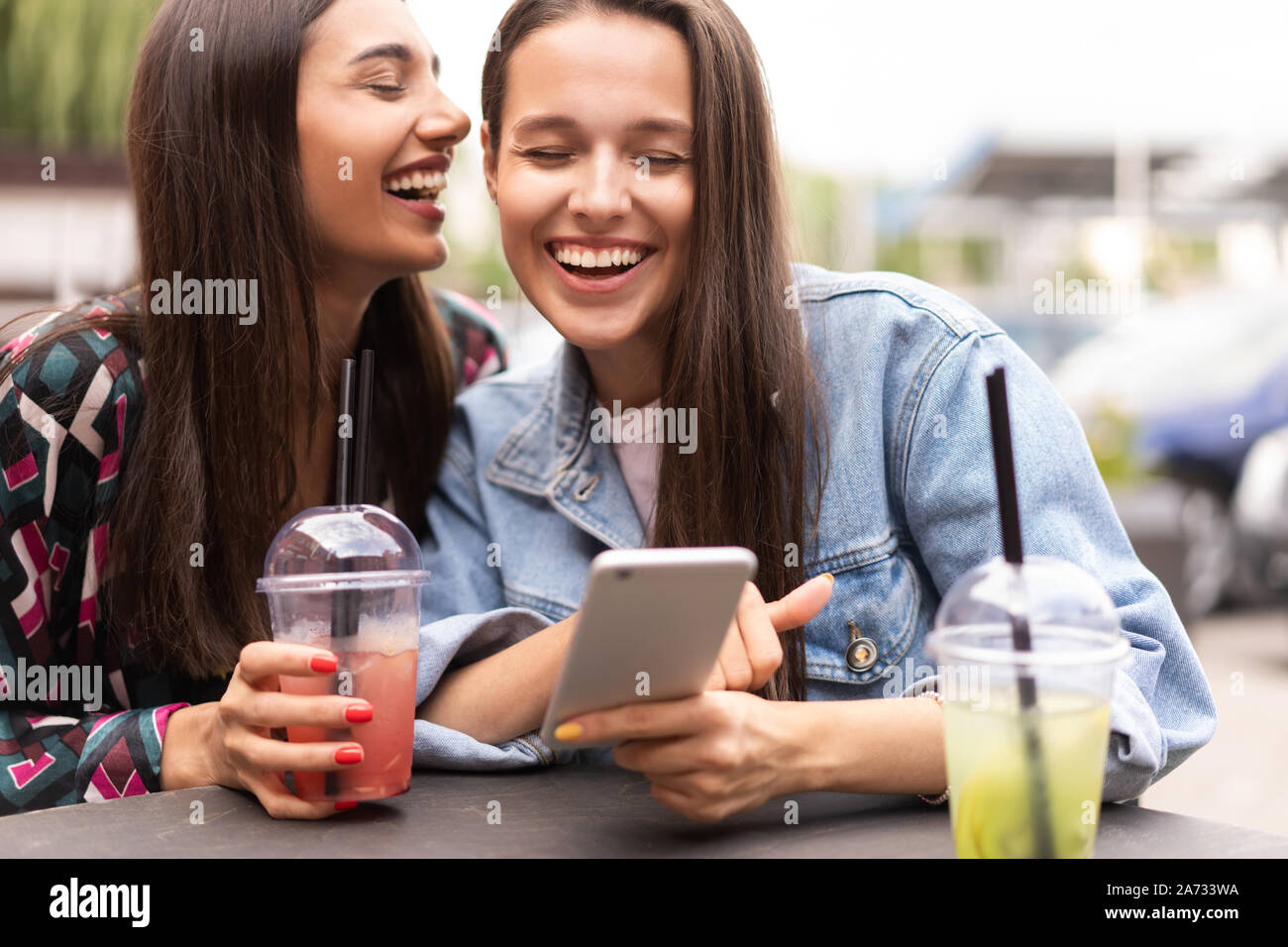 Two girls watching something in hi-res stock photography and images - Alamy