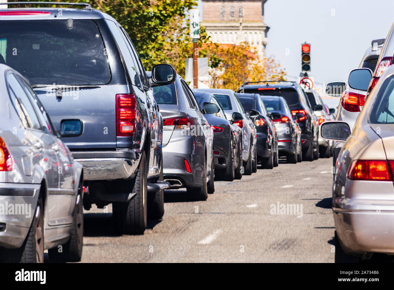 Heavy traffic in downtown San Francisco, California; cars stopped at a ...