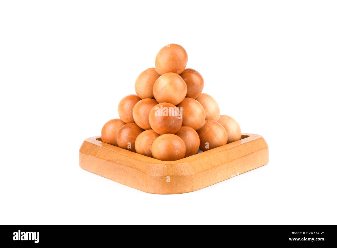 Three-dimensional puzzle pyramid of balls isolated on a white ...