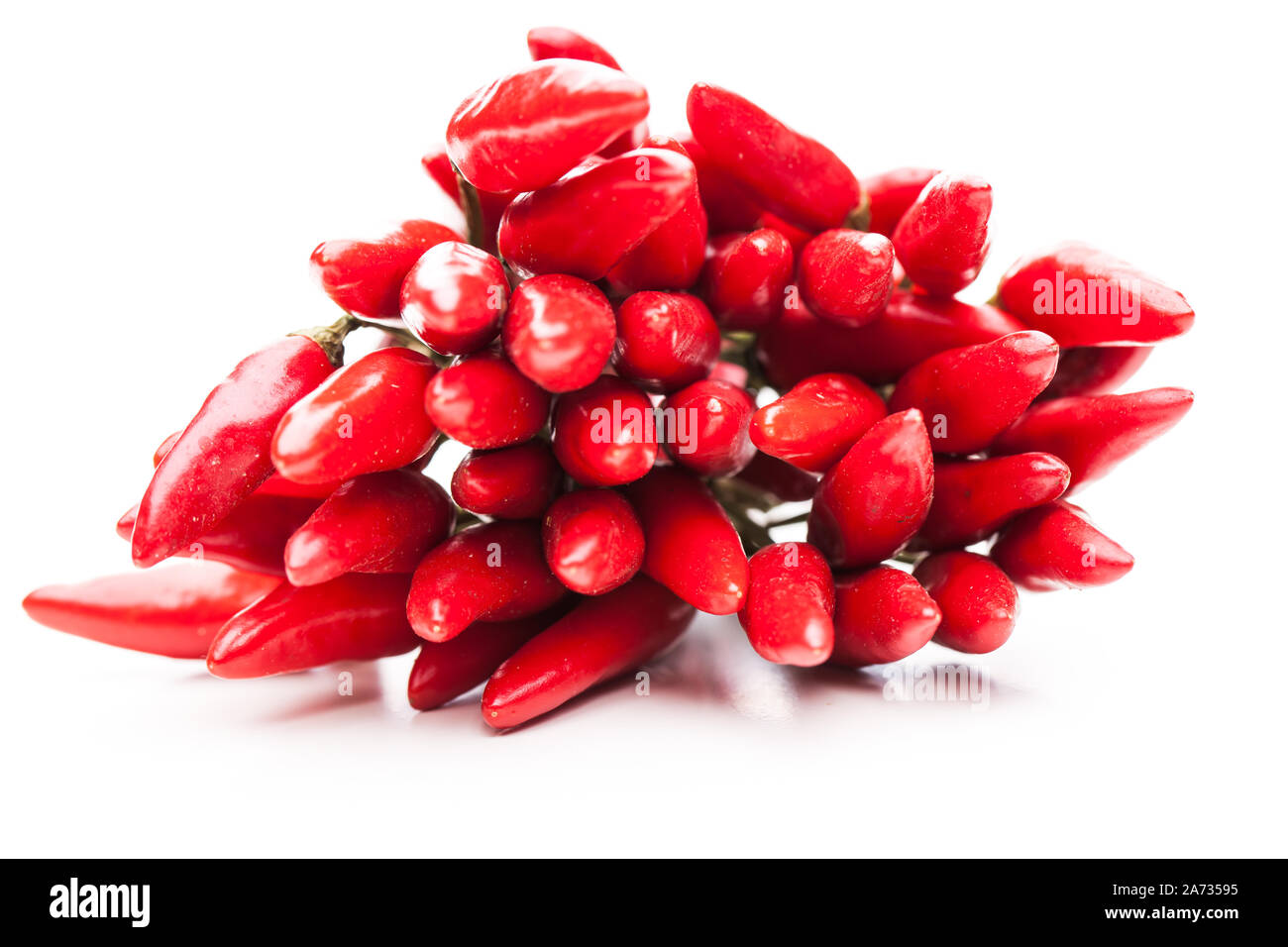Bunch of chilli peppers isolated on white background Stock Photo - Alamy