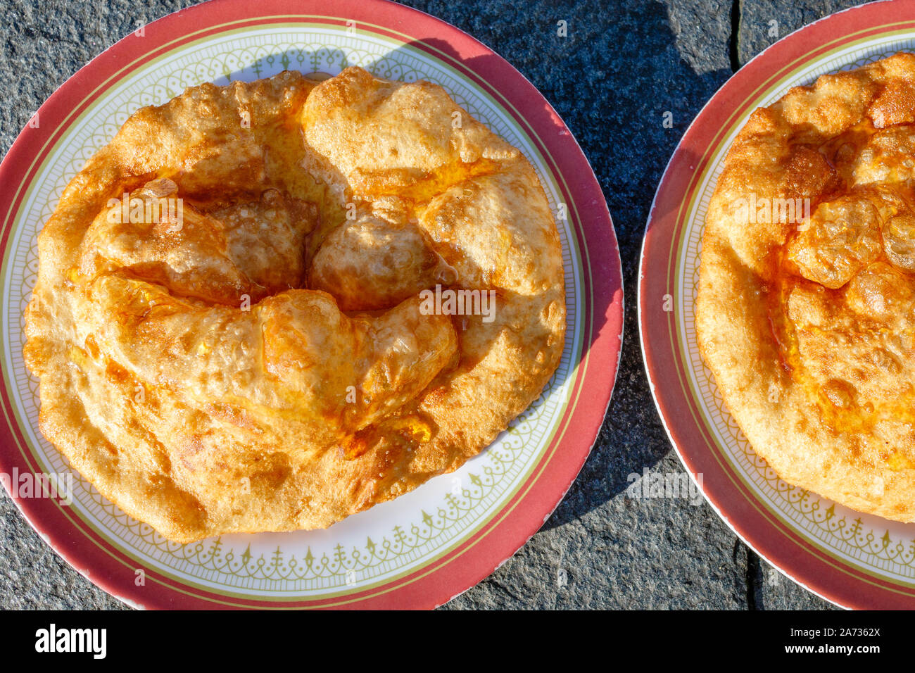 Numtrak balep, Tibetan deep fried bread on two plates. Popular ...