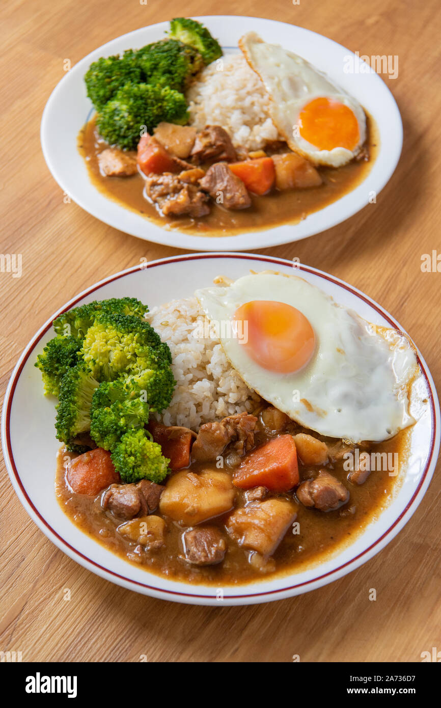 Chicken curry Rice on wooden background ( Poached egg, Potato, enoki ...