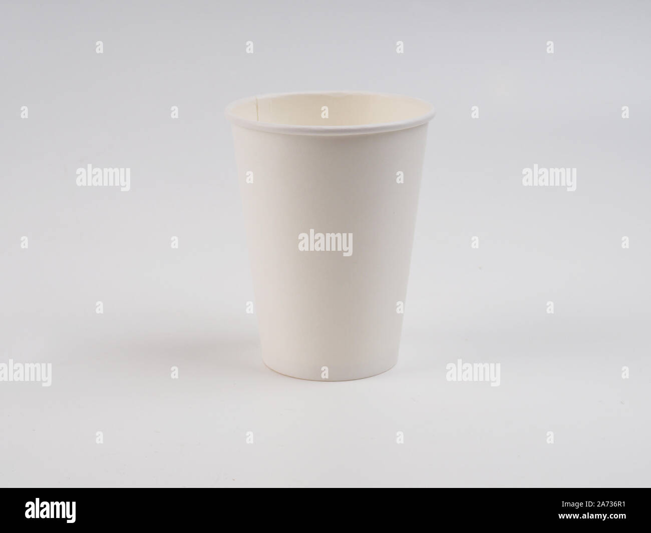 White Paper Cup. Over the white background Stock Photo - Alamy