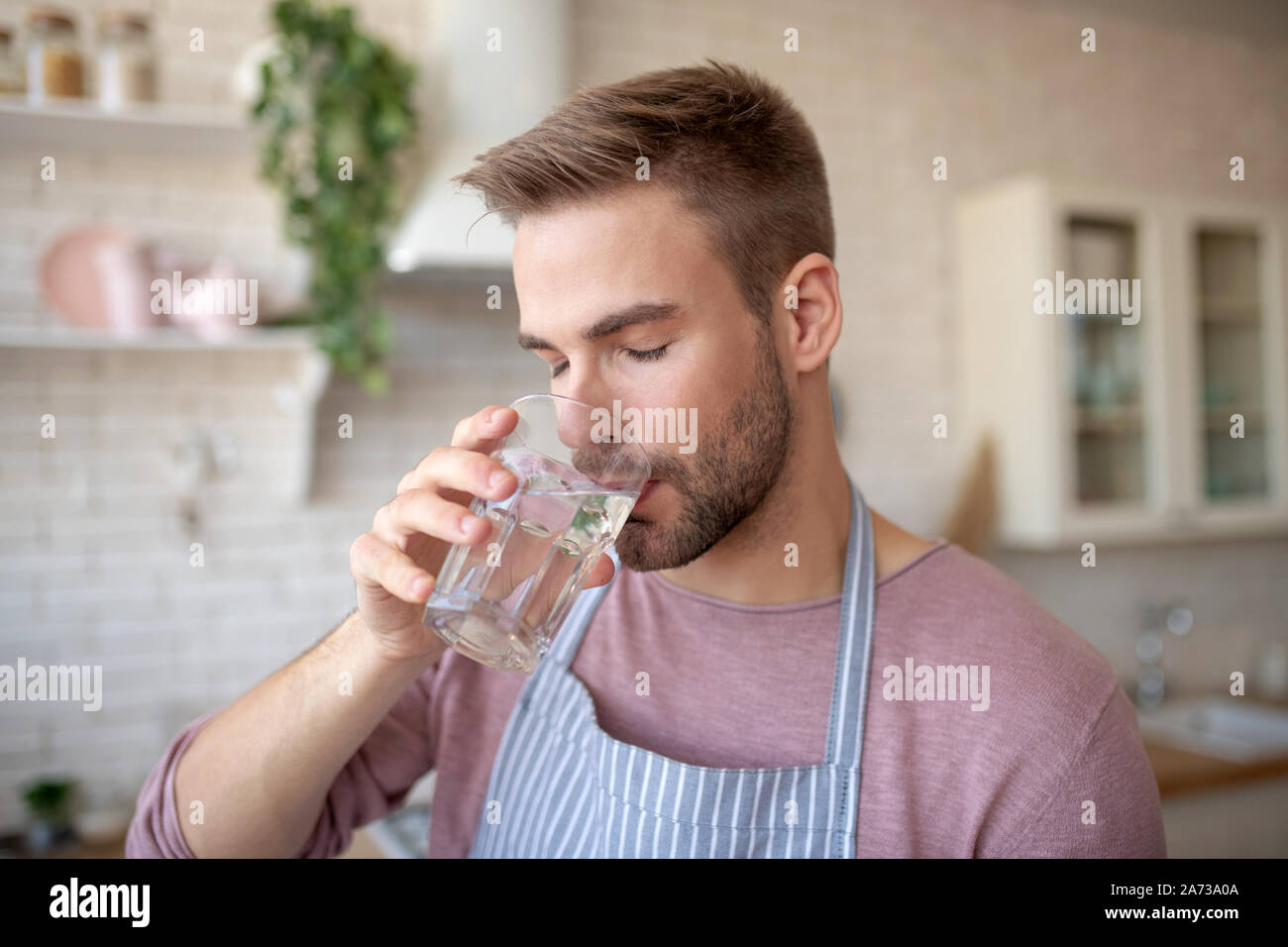 Man drinking glass water hi-res stock photography and images - Alamy