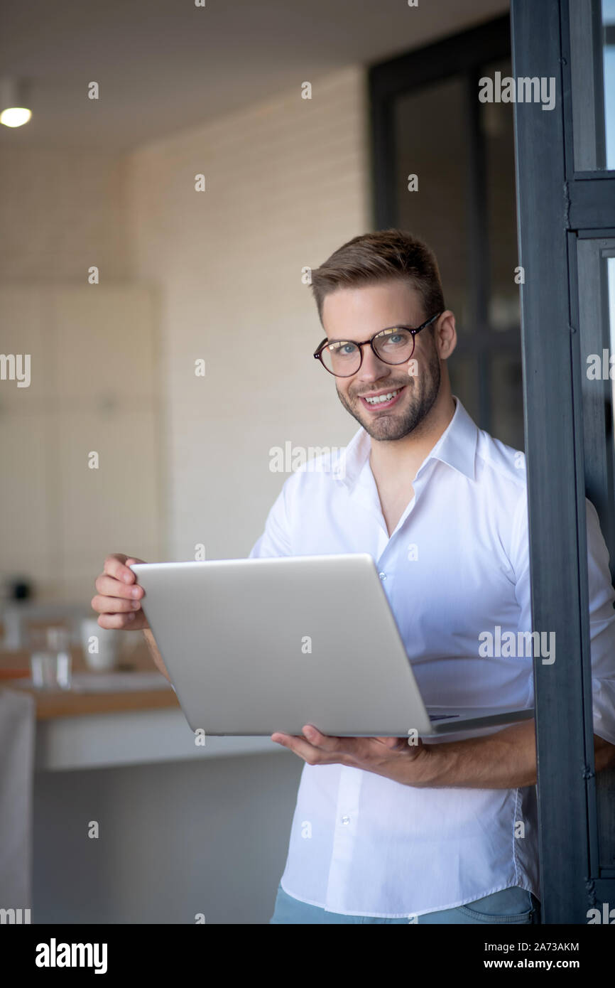 Businessman walking with laptop hi-res stock photography and images - Alamy