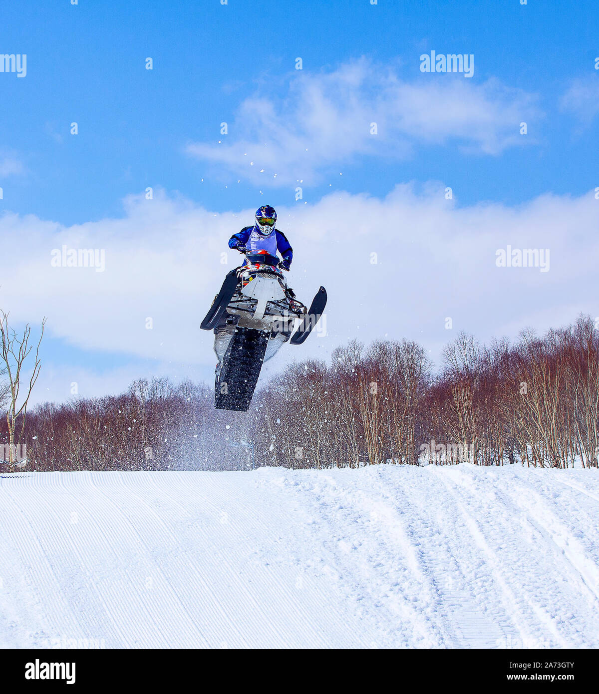 The Snowmobile in high jump above track Stock Photo - Alamy