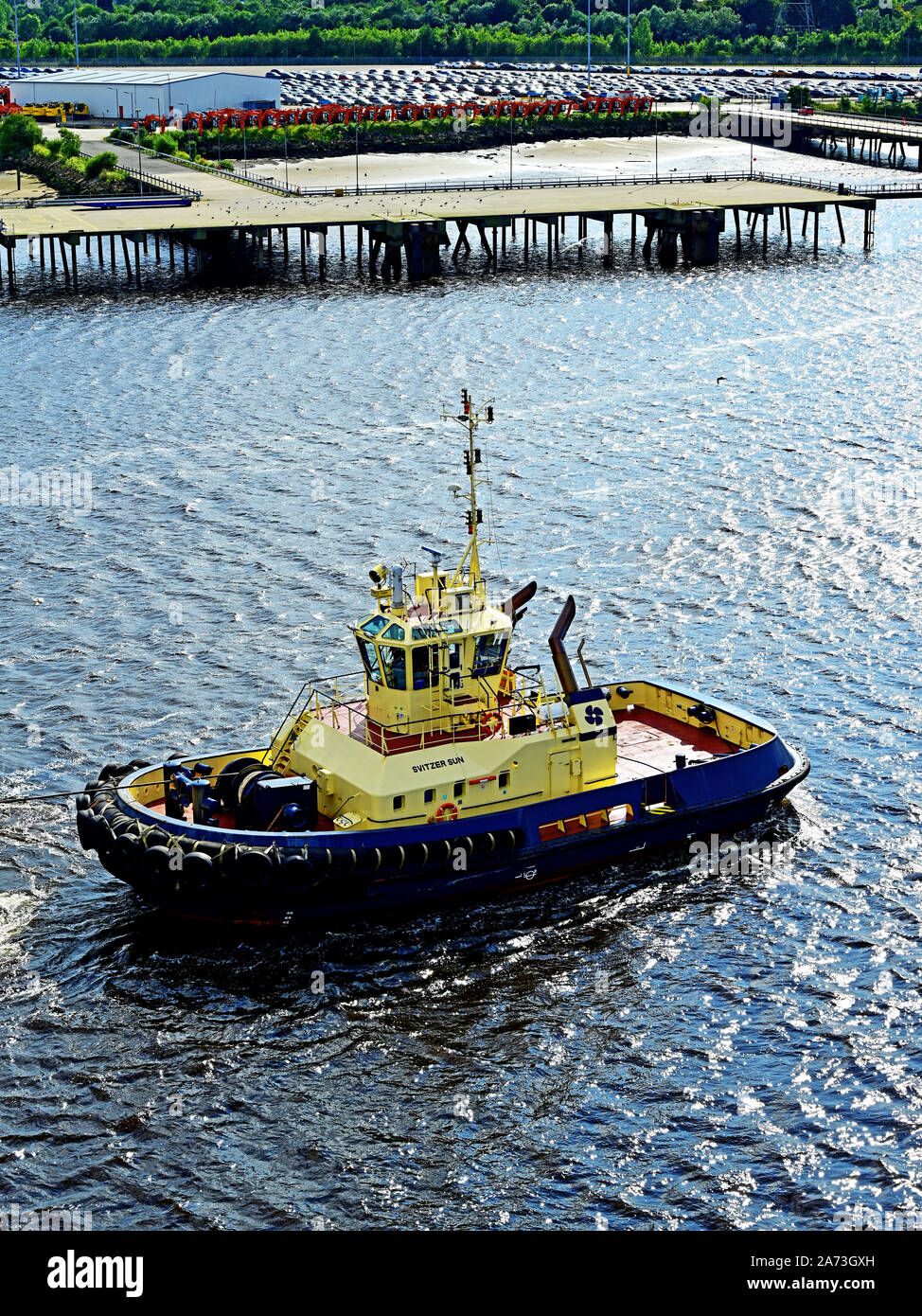 Front view of the Tyne tug Svitzer Sun as she tugs a cruise ship out of ...