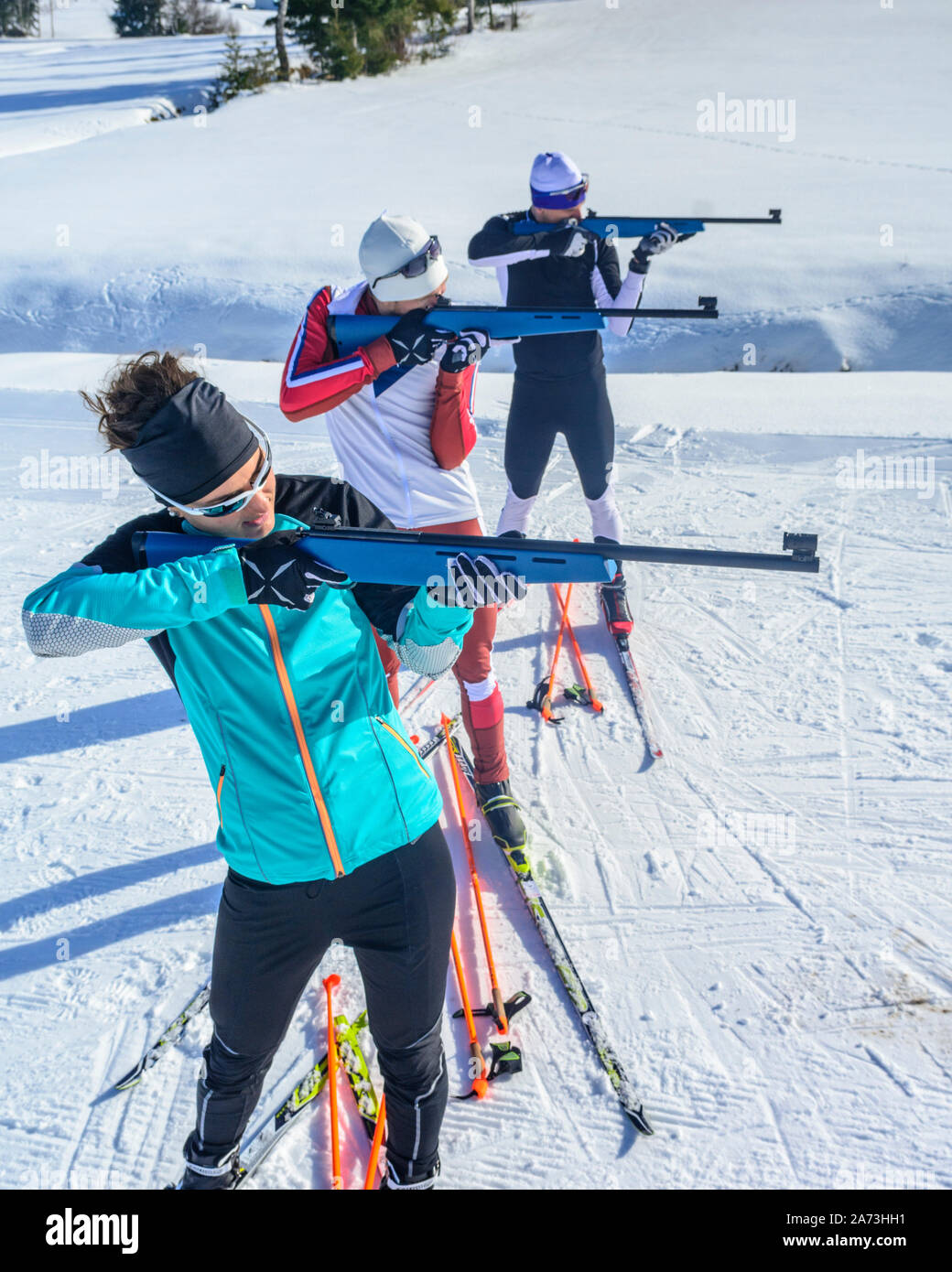 A group of sporty young people doing a biathlon competition Stock Photo ...