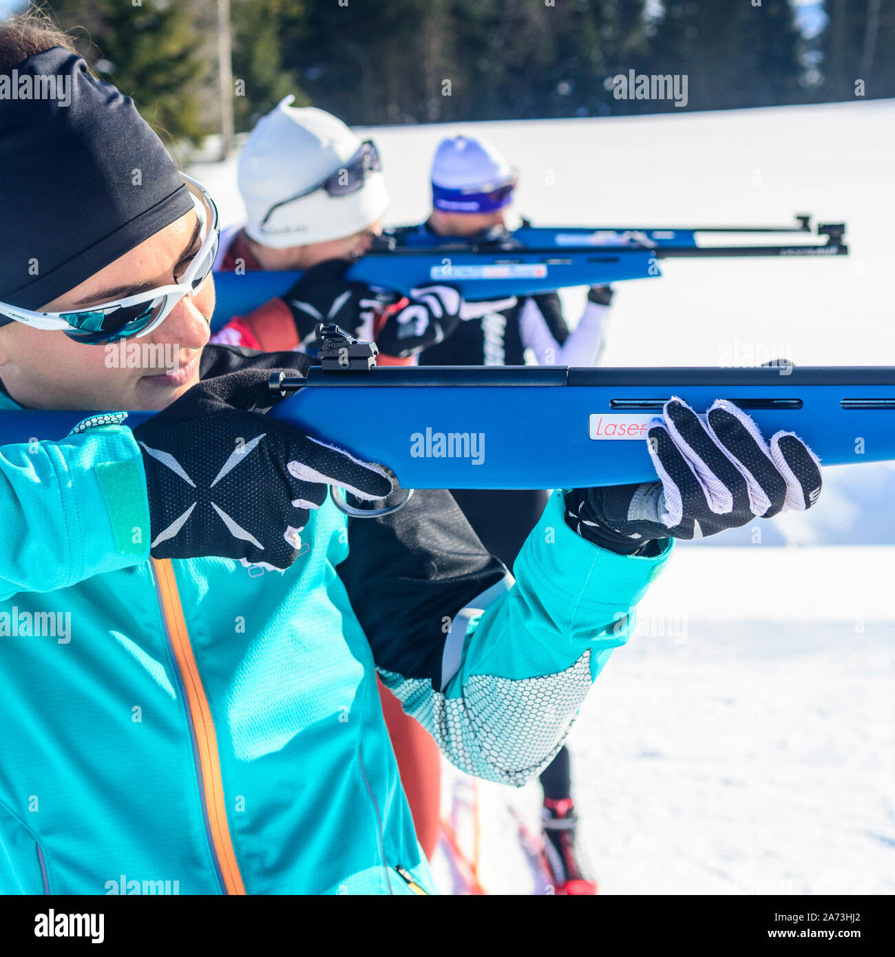 A group of sporty young people doing a biathlon competition Stock Photo ...