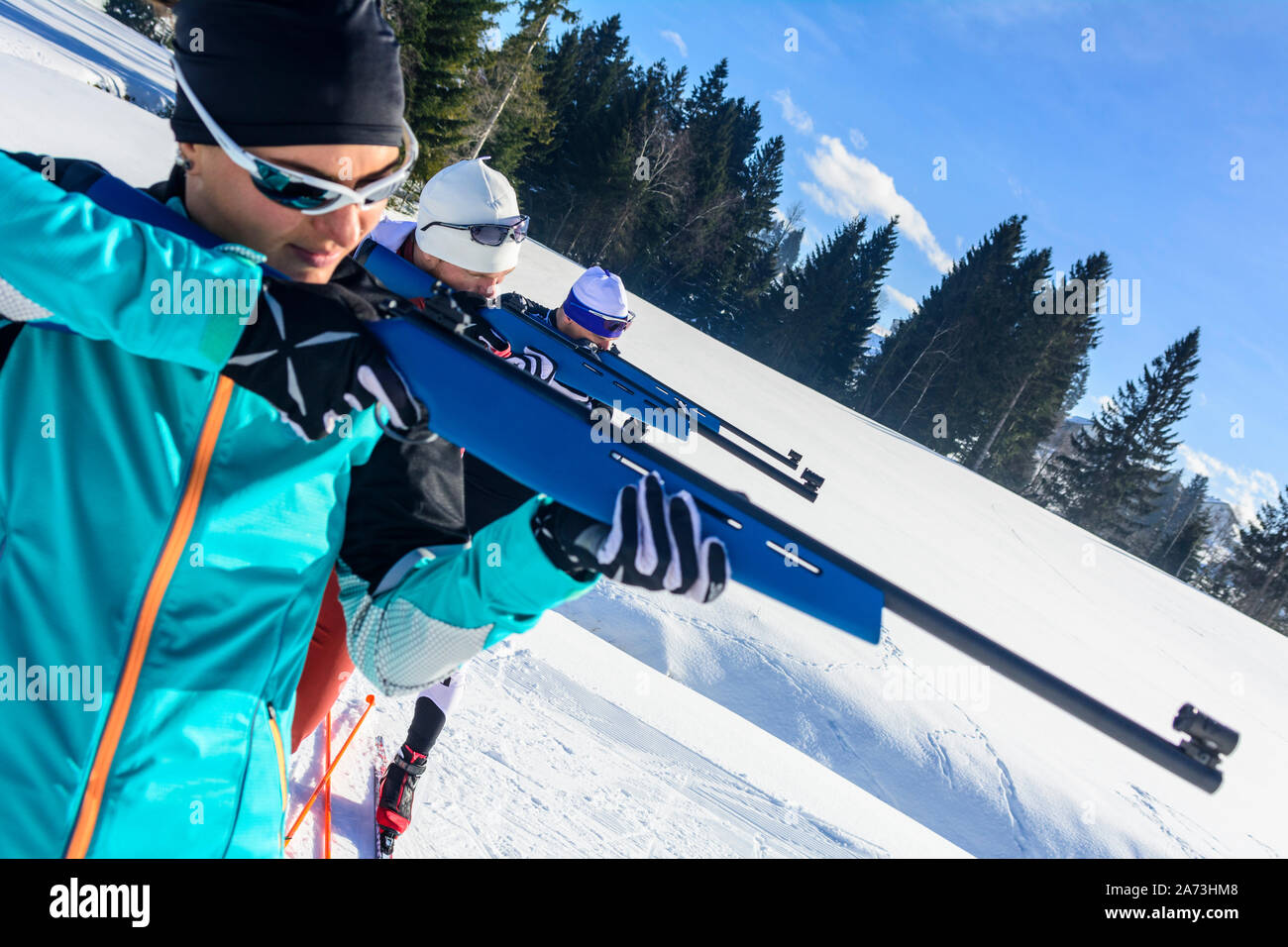 A group of sporty young people doing a biathlon competition Stock Photo ...