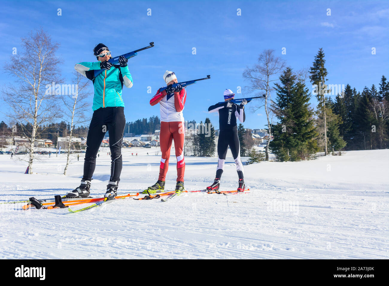 A group of sporty young people doing a biathlon competition Stock Photo ...