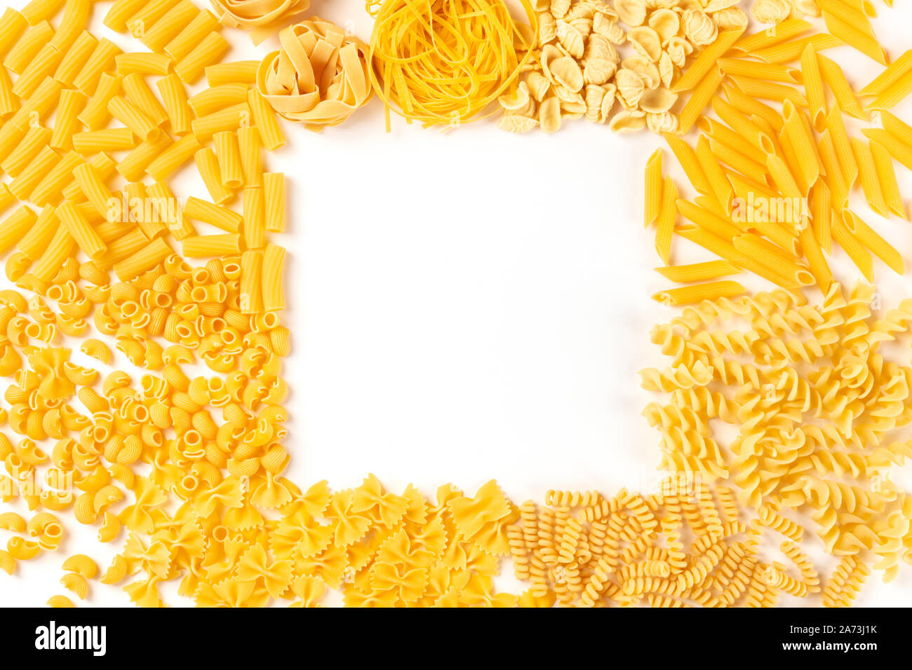 Italian pasta forming a square frame on a white background, shot from ...