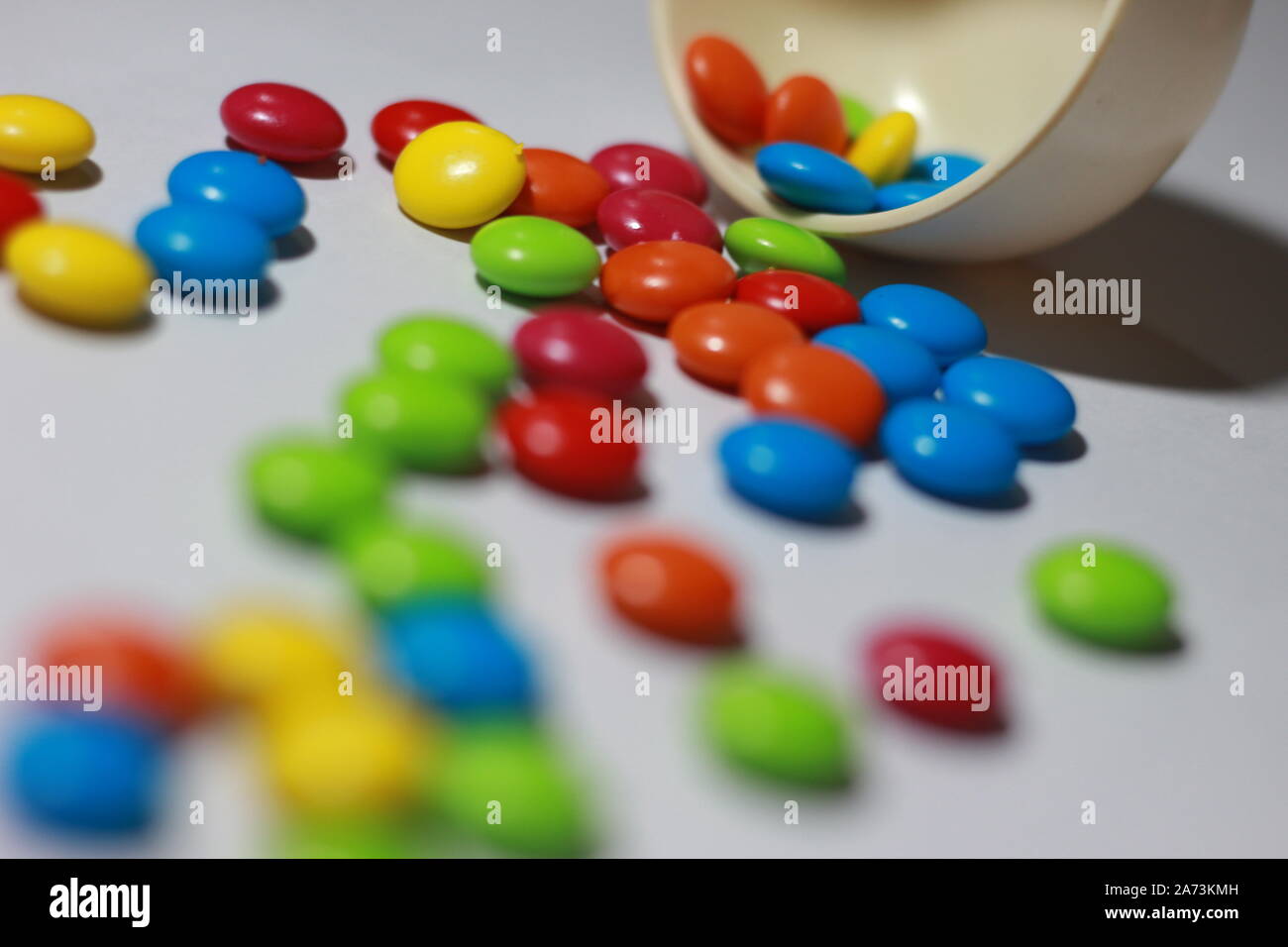 Sugar Coated Chocolate Gems Candy Stock Photo - Alamy