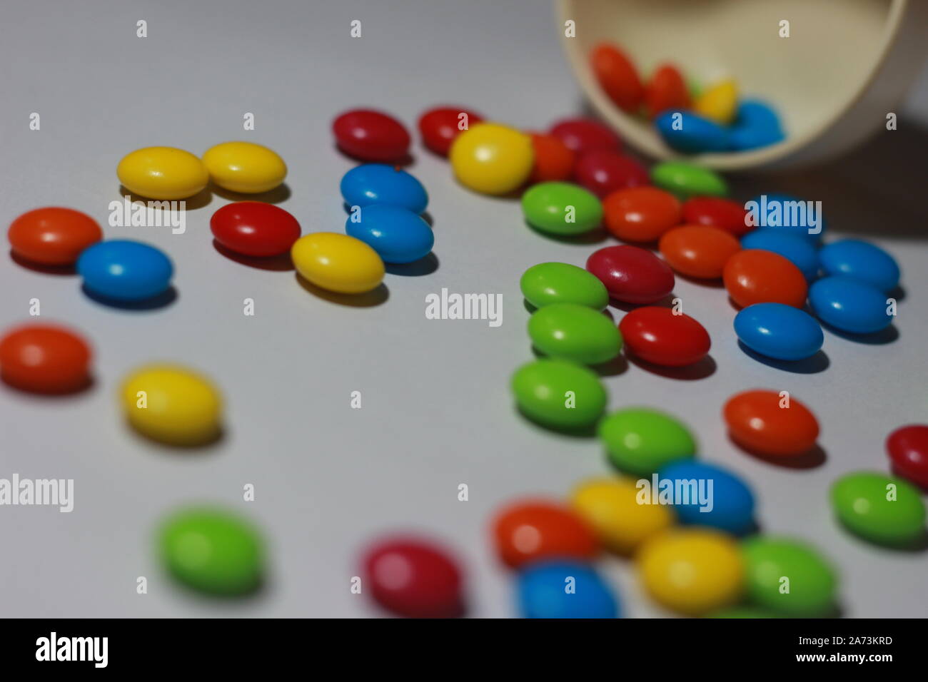 Sugar Coated Chocolate Gems Candy Stock Photo - Alamy