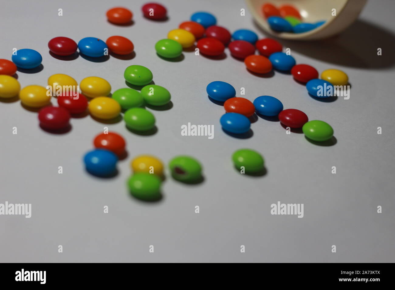 Sugar Coated Chocolate Gems Candy Stock Photo - Alamy