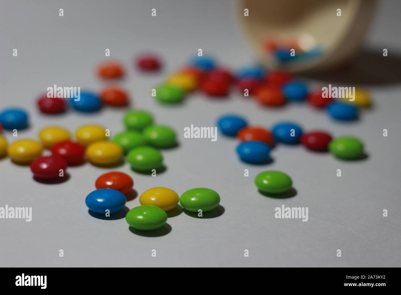 Sugar Coated Chocolate Gems Candy Stock Photo - Alamy