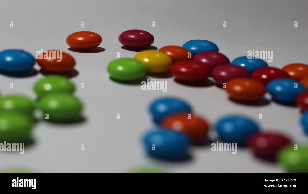 Sugar Coated Chocolate Gems Candy Stock Photo - Alamy