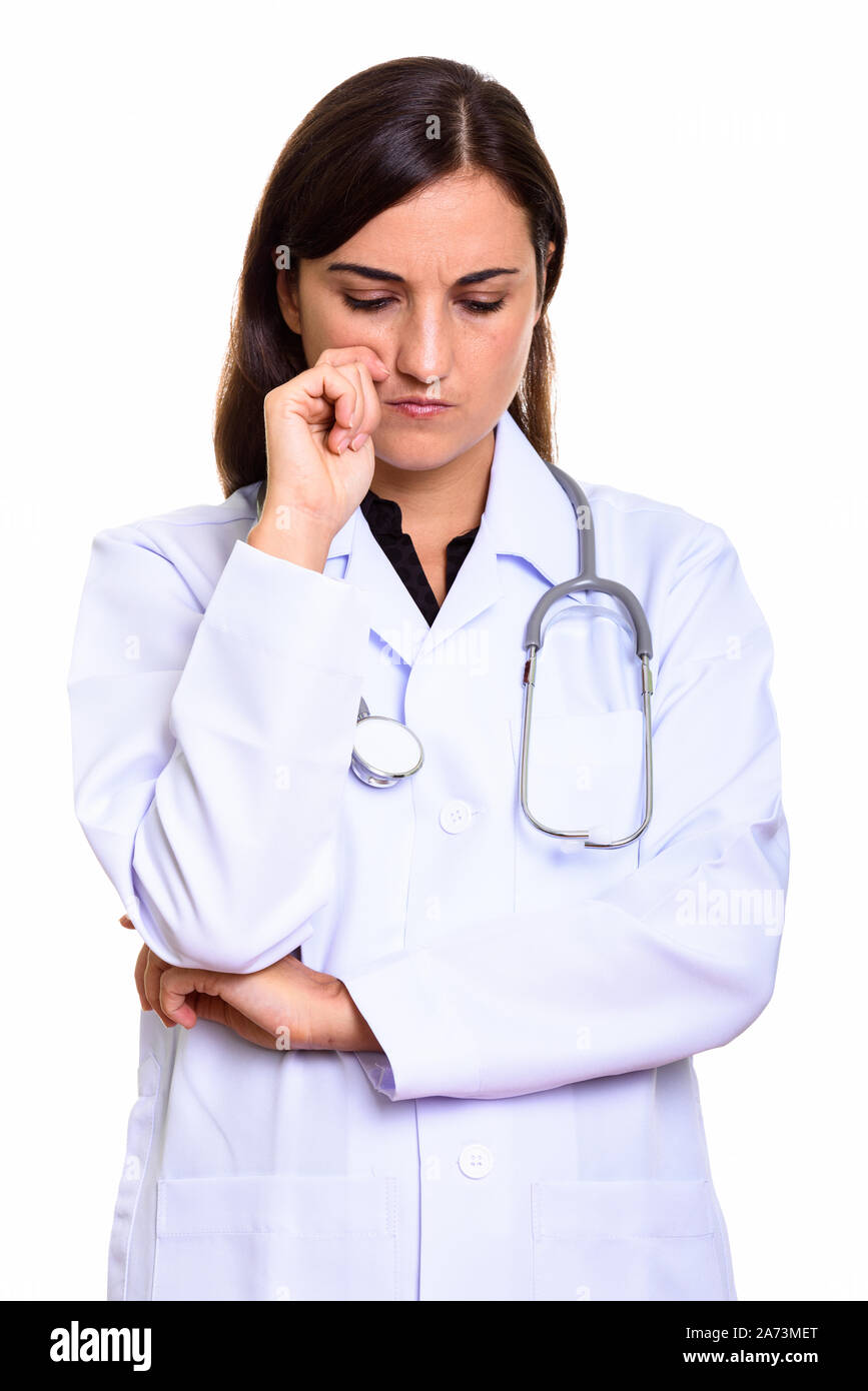 Studio shot of sad woman doctor thinking Stock Photo - Alamy