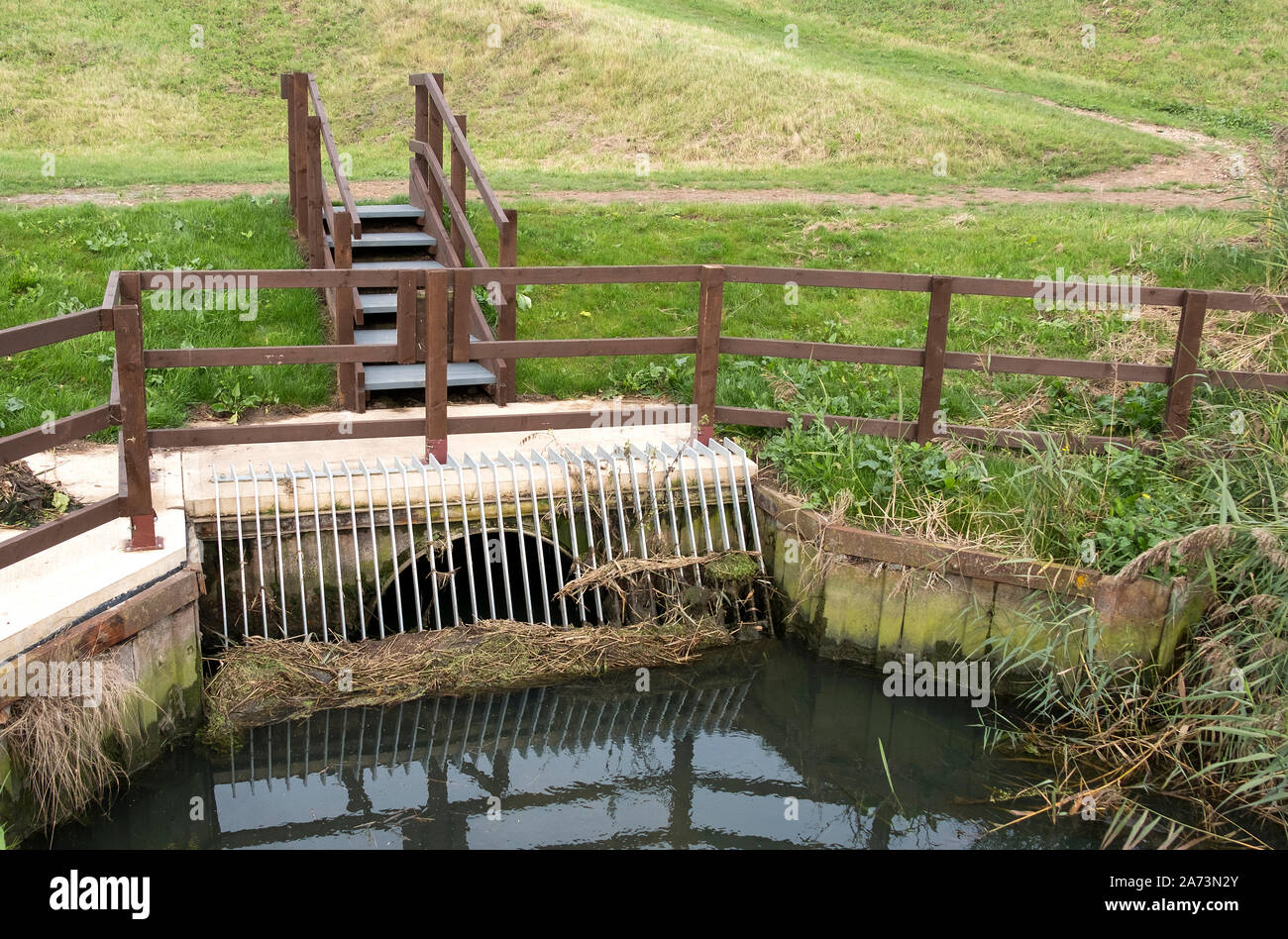 Overflow drain grate blocked Stock Photo - Alamy