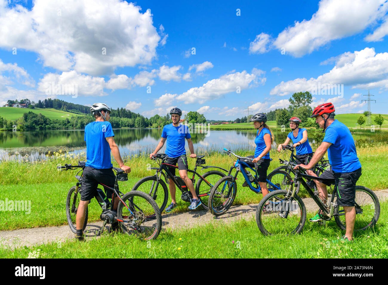 Cycling with the team Stock Photo - Alamy