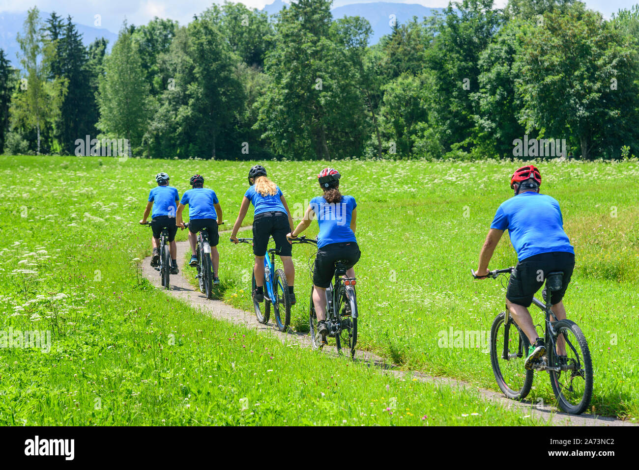 Cycling with the team Stock Photo - Alamy