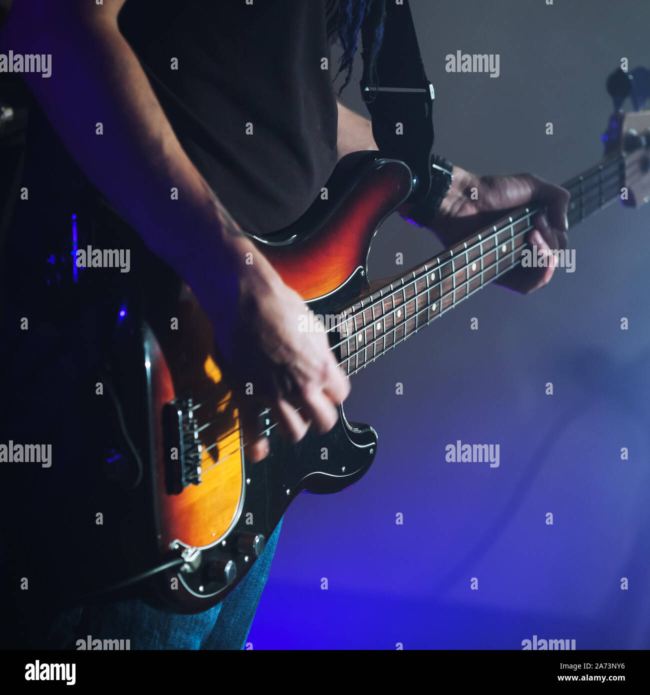 Musician plays bass guitar close hi-res stock photography and images ...