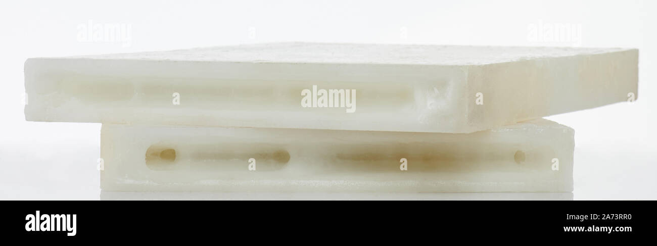 Blocks of white industrial wax isolated close up view Stock Photo - Alamy