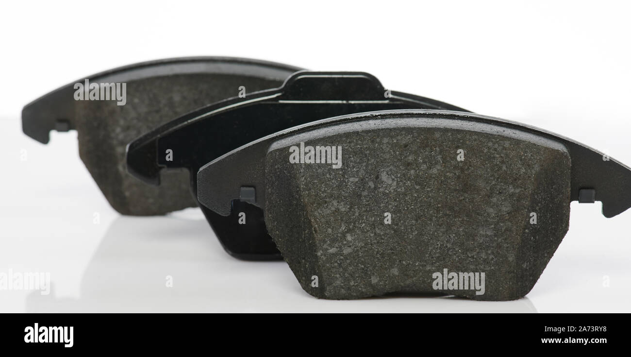 Black metal car breaking pads row isolated on white background. New ...