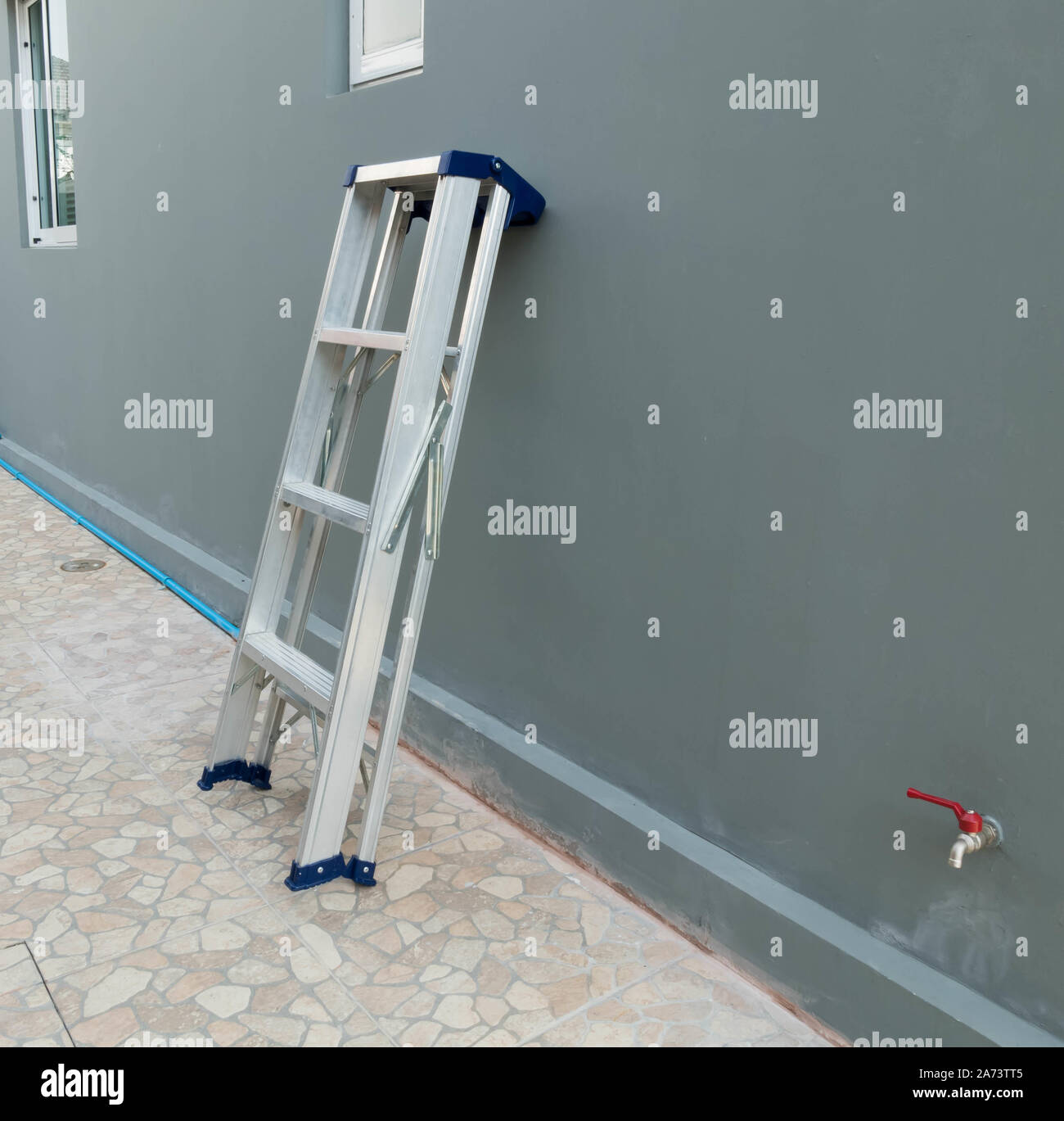 Ladder leaning against the house Stock Photo - Alamy