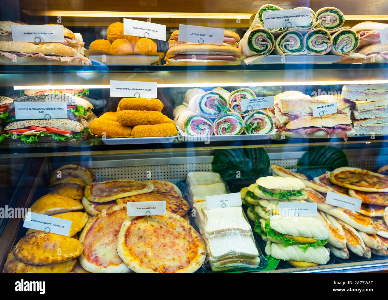 Showcase with assortment of Italian fast food with various fillings ...