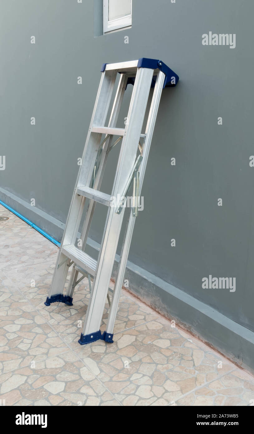 Ladder leaning against the house Stock Photo - Alamy