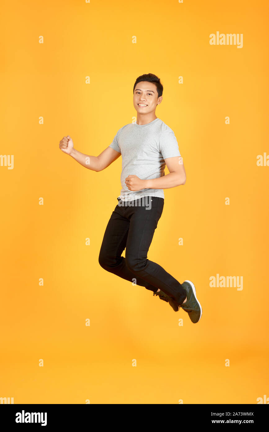 Young teenage boy jumping joy hi-res stock photography and images - Alamy