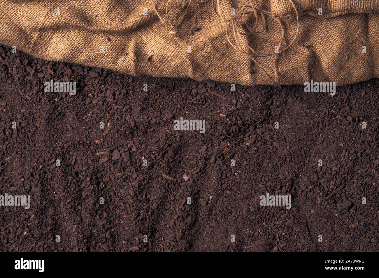 Botany humus compost soil mix top view with hessian burlap sack ...
