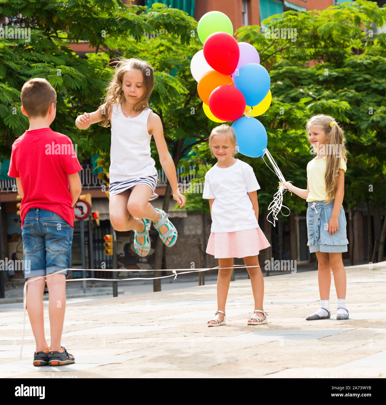 Portrait four happy friends jumping hi-res stock photography and images ...
