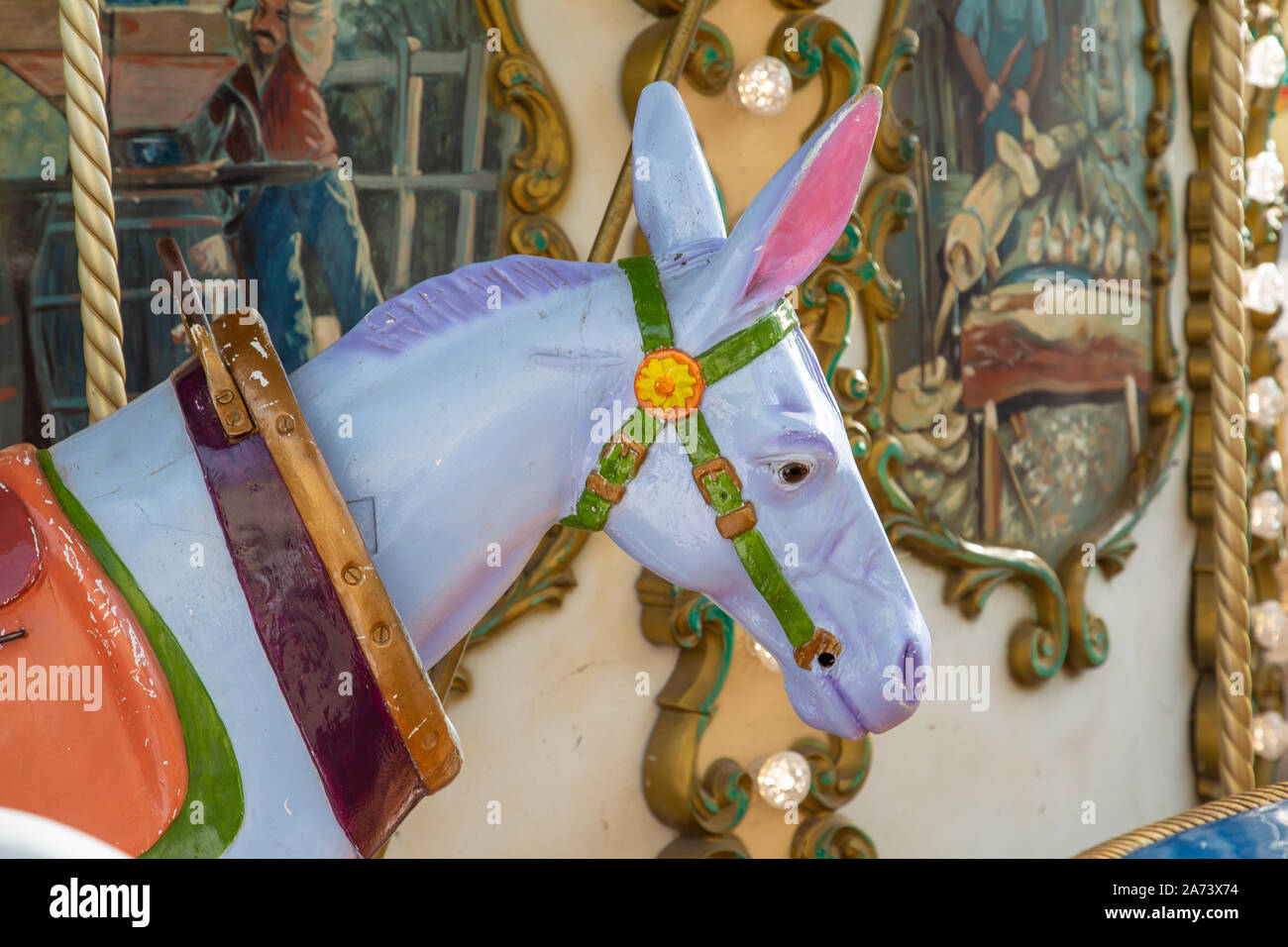 Colorful wooden donkeyof a children circus carousel Stock Photo - Alamy