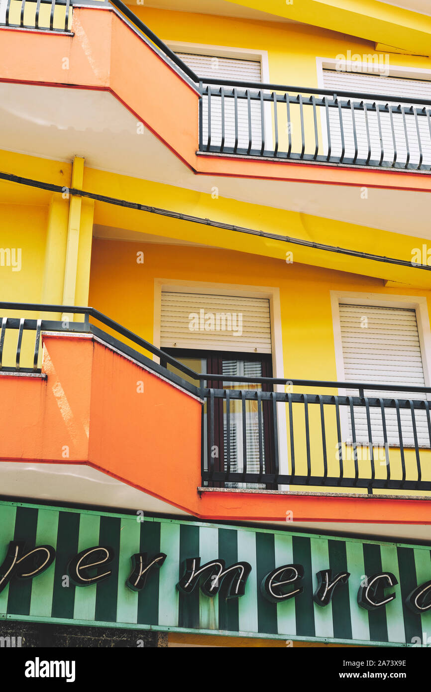 Modern building painted yellow orange green architectural detail ...