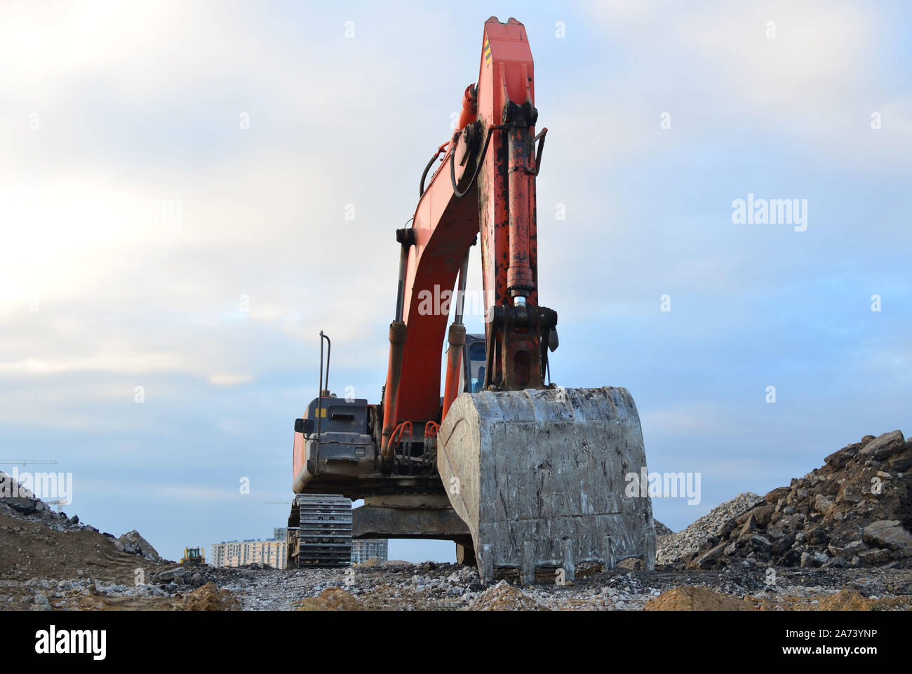 Large tracked excavator works in a gravel pit. Salvaging and recycling ...