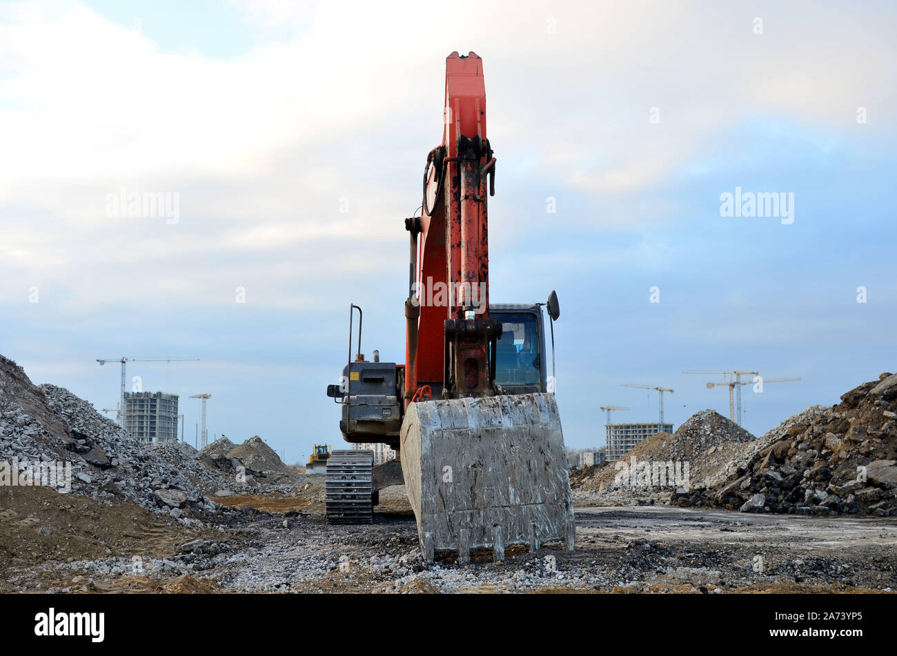 Large tracked excavator works in a gravel pit. Salvaging and recycling ...