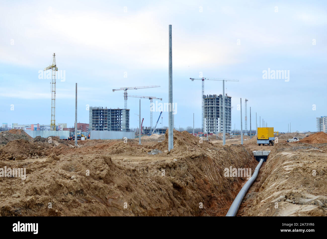 Laying of underground storm sewer pipes. Installation of water main ...