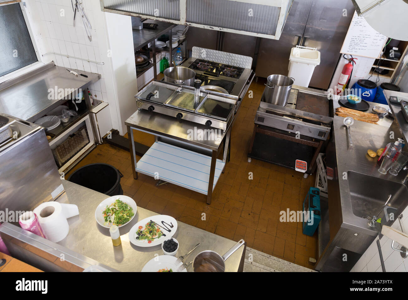 Typical working kitchen interior in restaurant with variety of ...