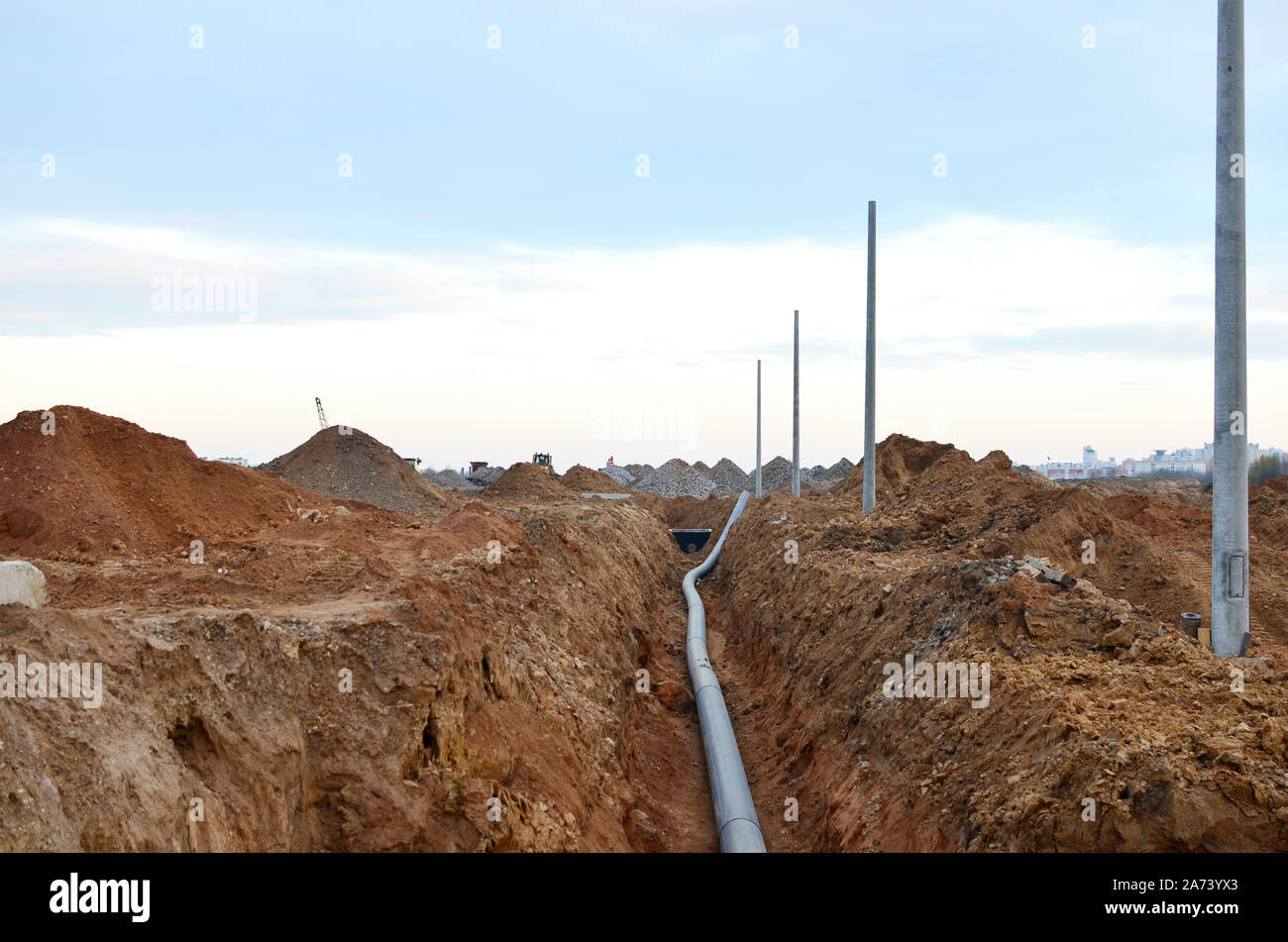 Laying of underground storm sewer pipes. Installation of water main ...
