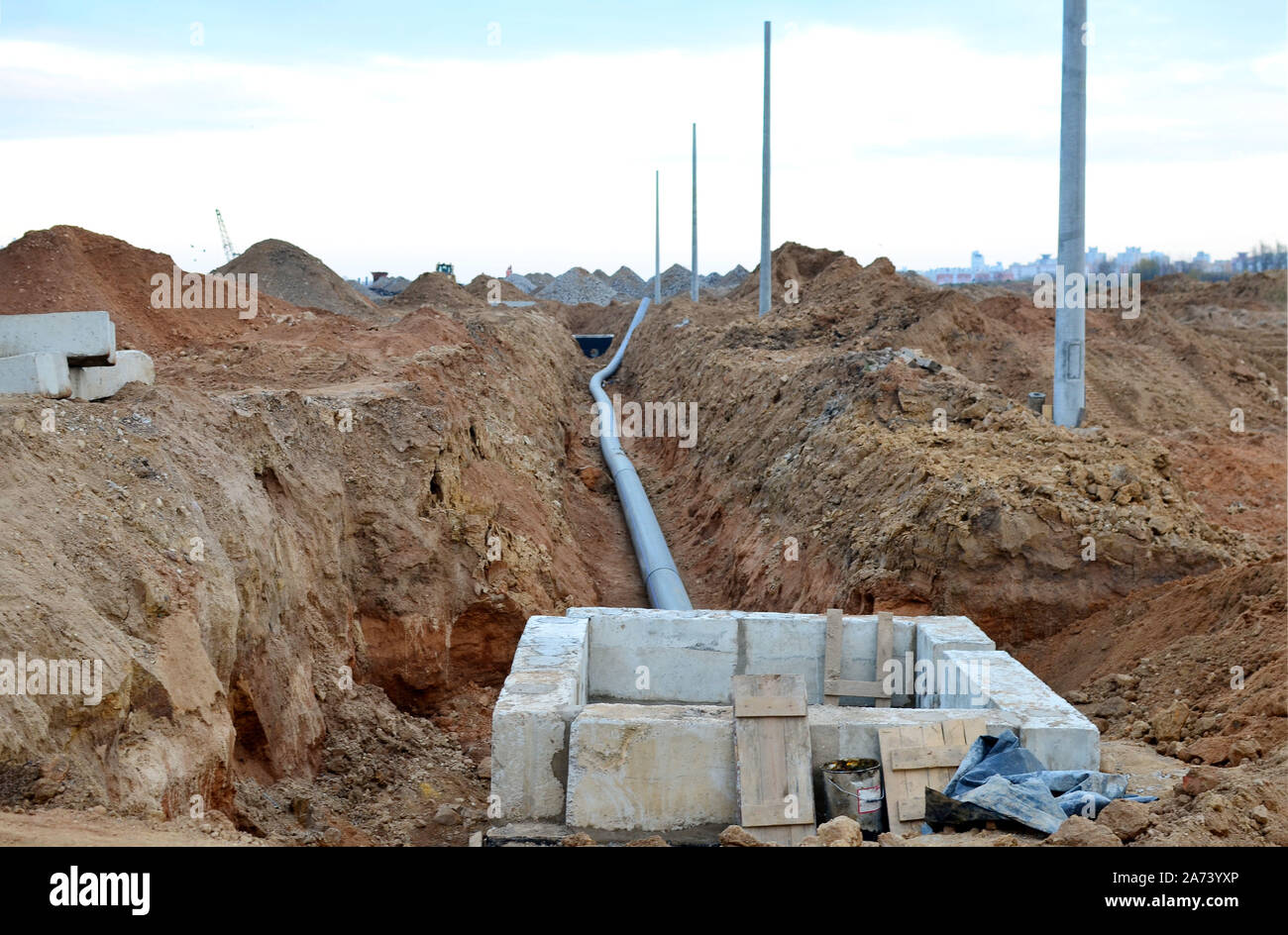 Laying of underground storm sewer pipes. Installation of water main ...